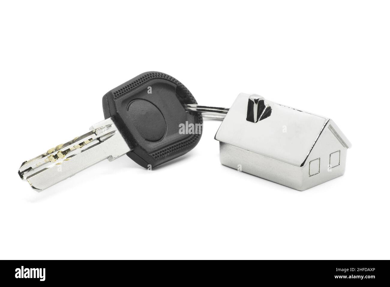 House keys and key-chain isolated on white background. Real estate ...