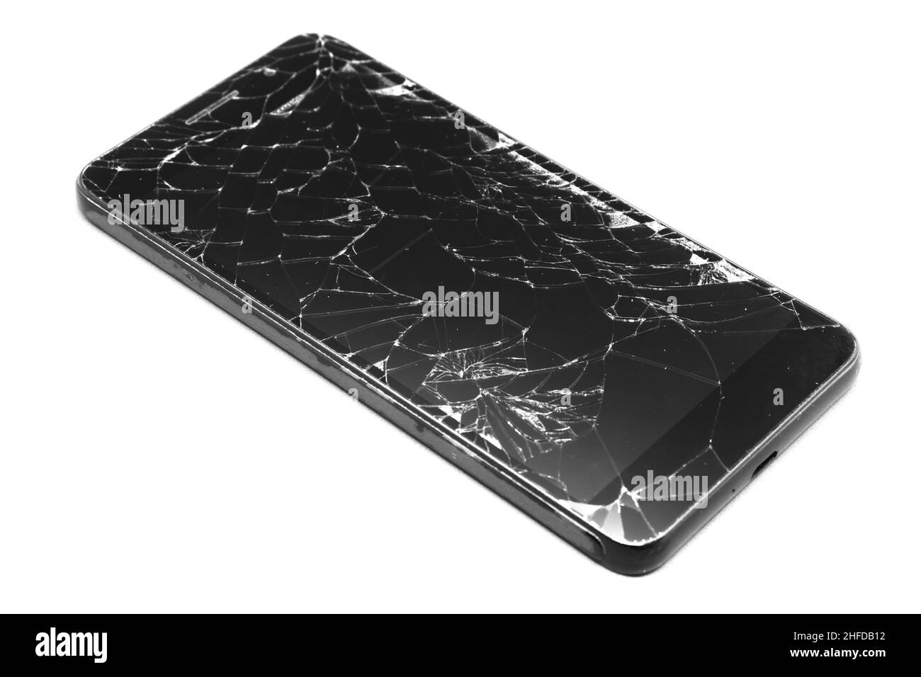 Broken display on a black smartphone isolate on a white background ... Broken display on a black smartphone isolate on a white background ...