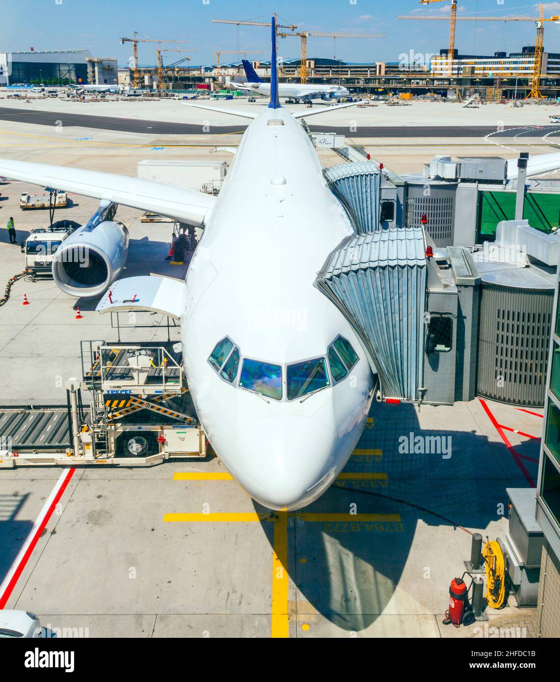 aircraft at the finger in the airport Stock Photo - Alamy