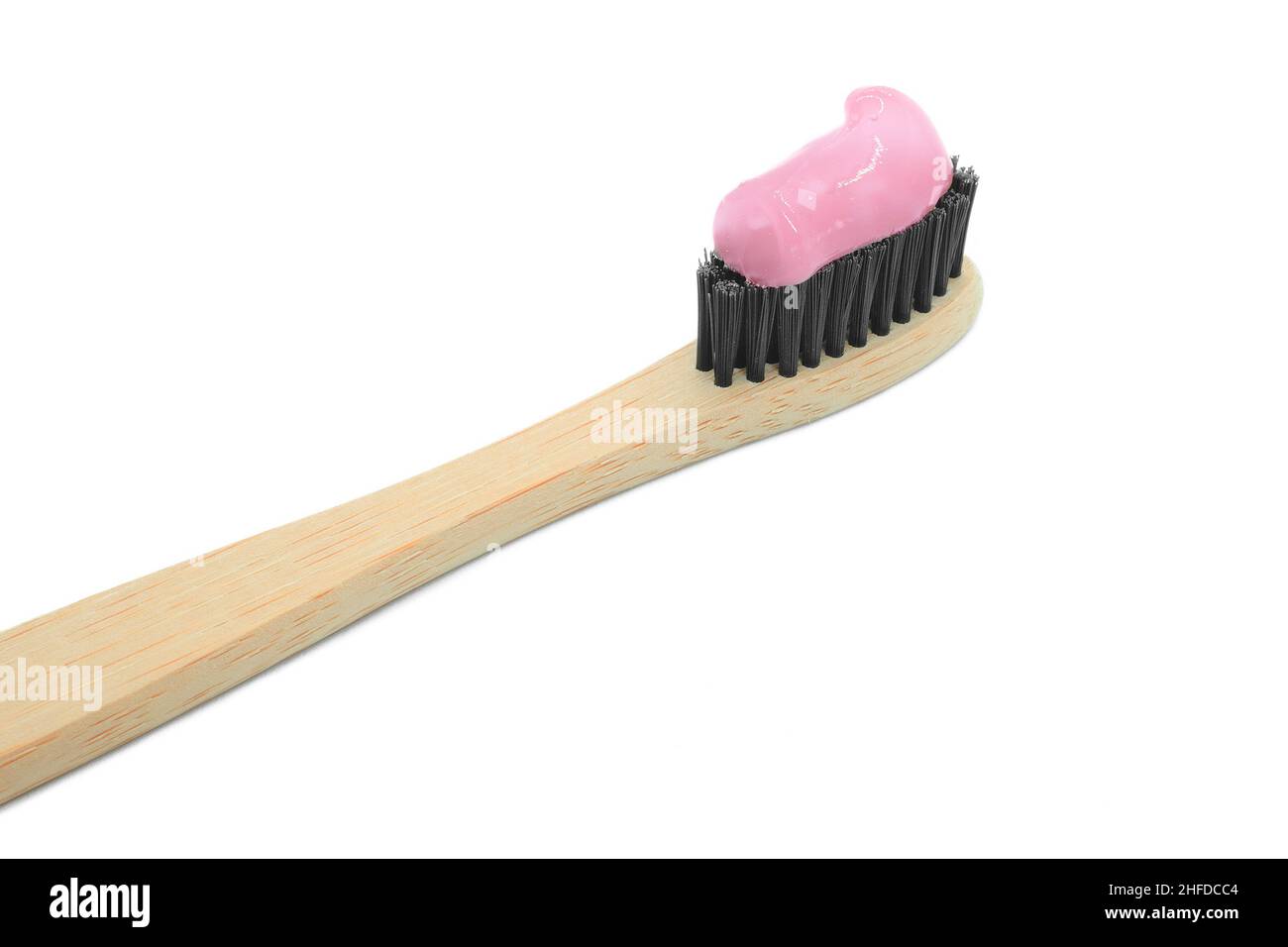 Closeup of bamboo toothbrush with blue toothpaste isolated on white ...