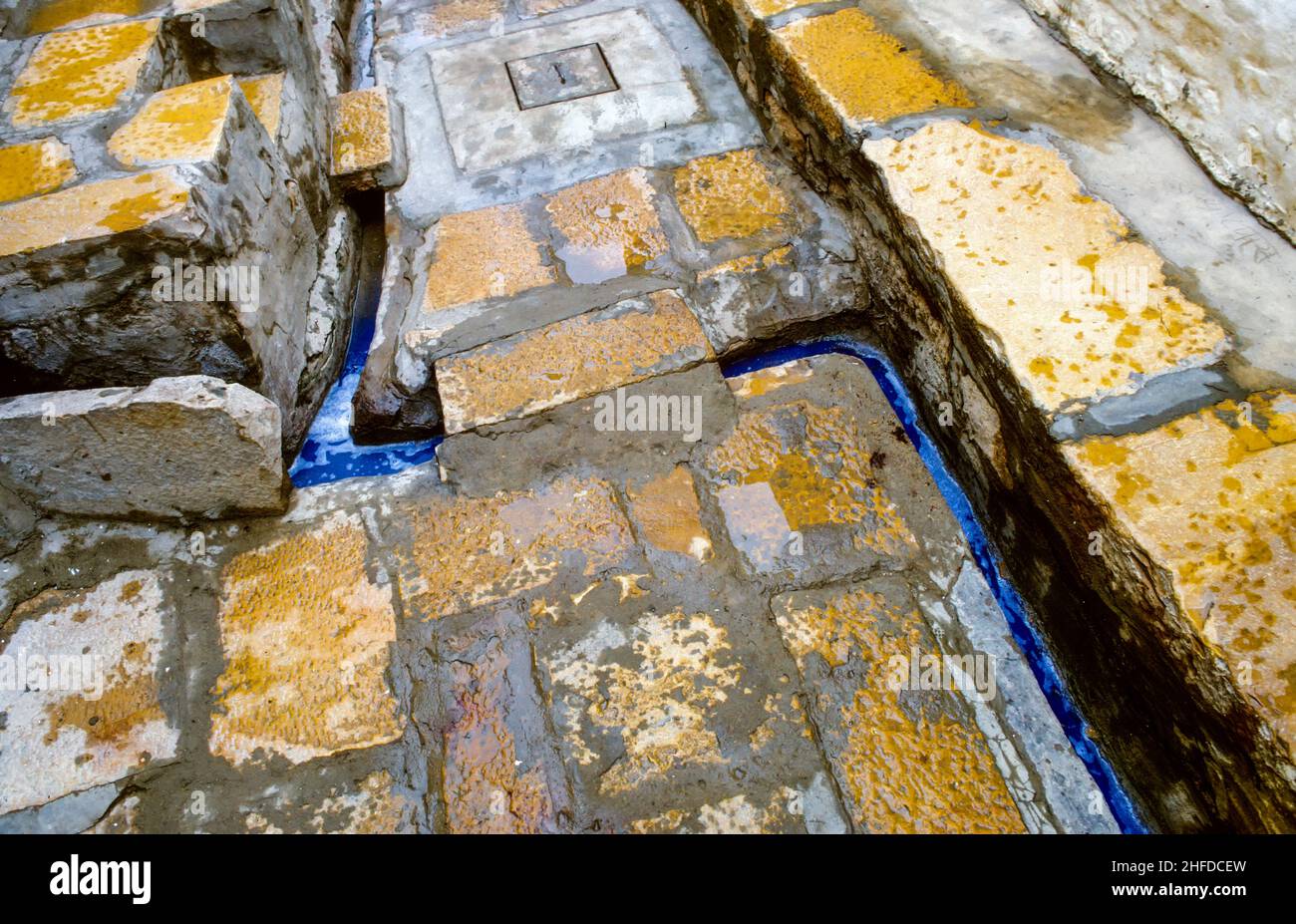 open canalization system in jaisalmer, India with blue water from ...