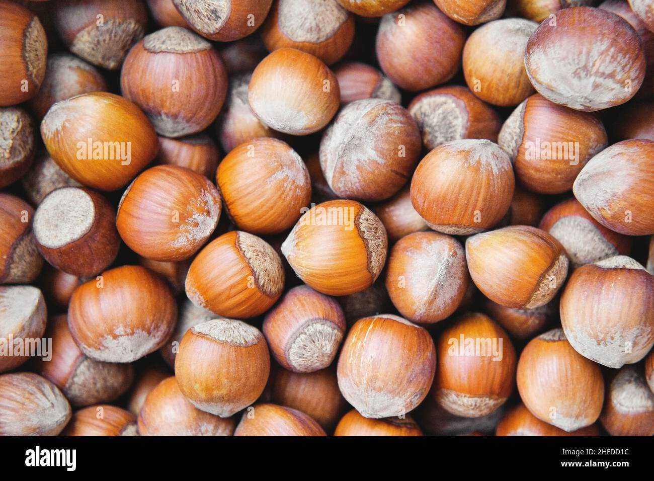 Stack of shelled hazelnuts background. Hazelnut textured pattern. Food ...