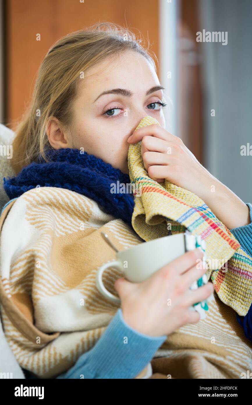 Young woman suffering of cold and having stuffy nose Stock Photo - Alamy