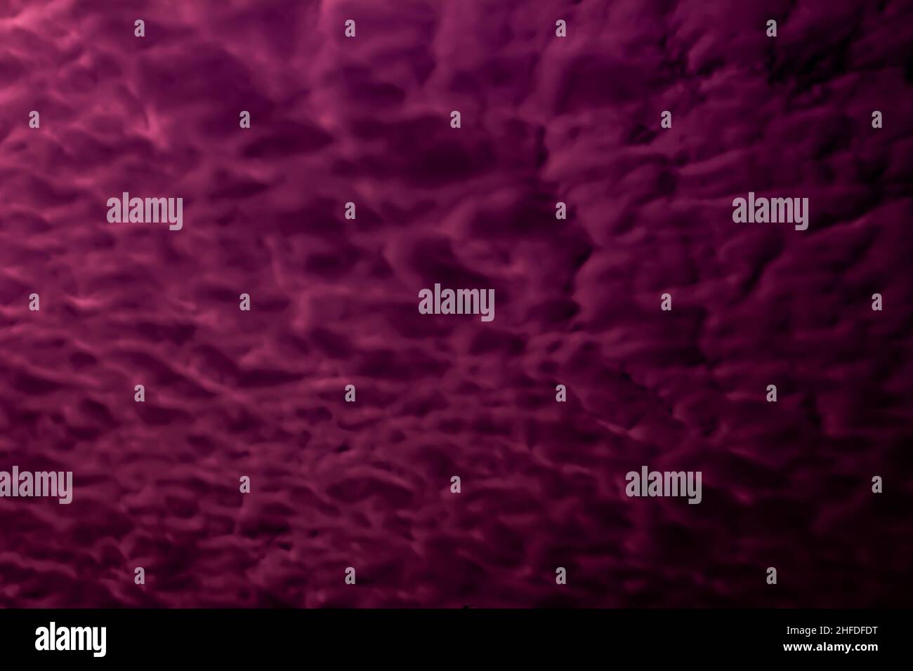 Abstract crimson colored background with textures of different shades ...