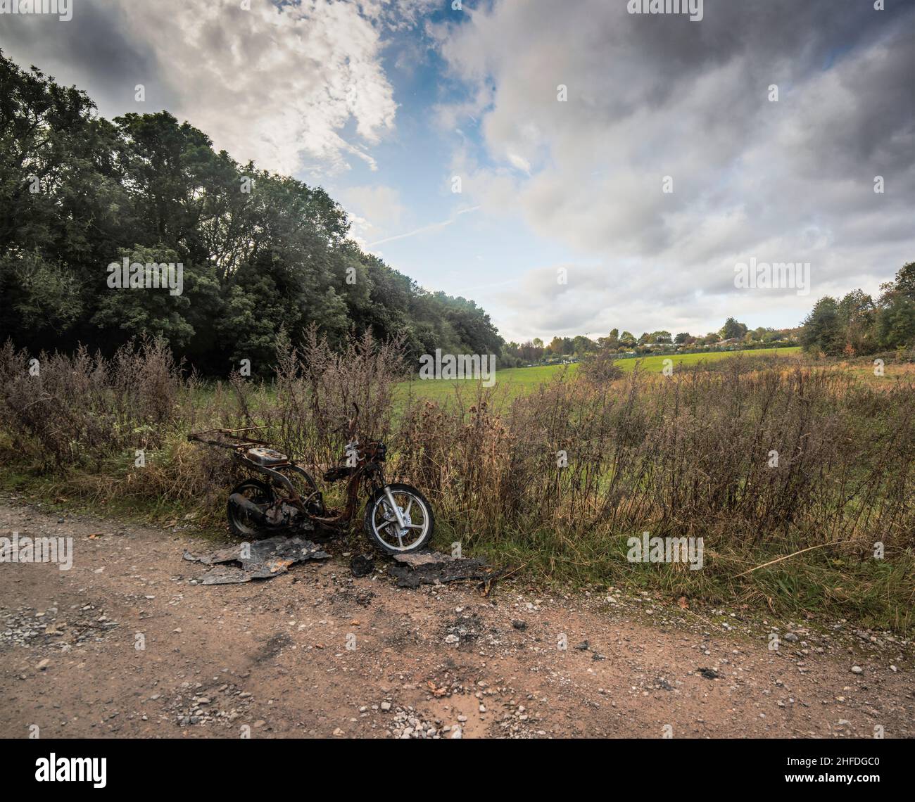 Stolen, burned out and abandoned motorcycle in the countryside Stock ...