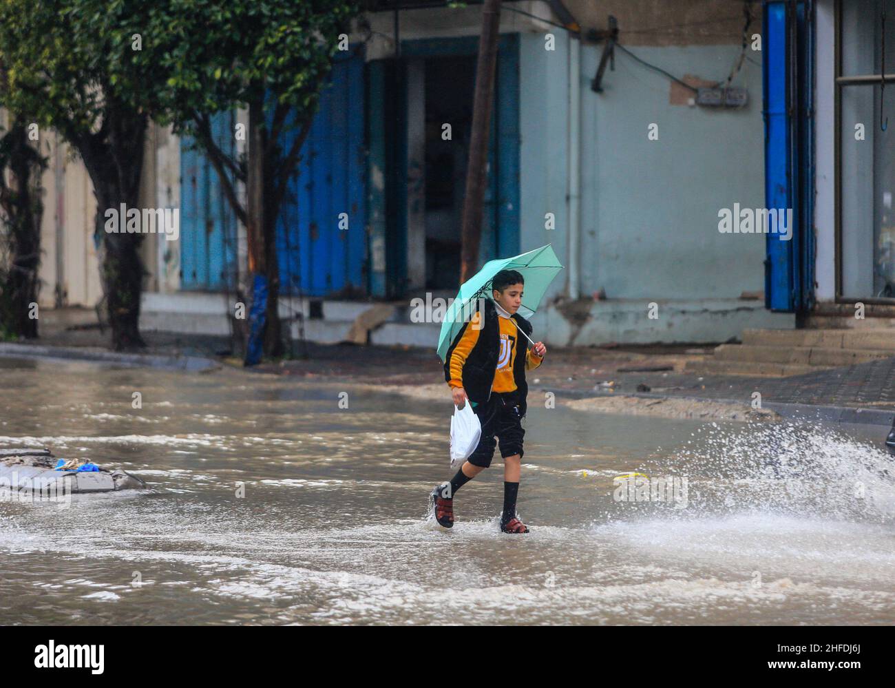 Gaza, Palestine. 15th Jan, 2022. A Palestinian kid seen walking with an ...