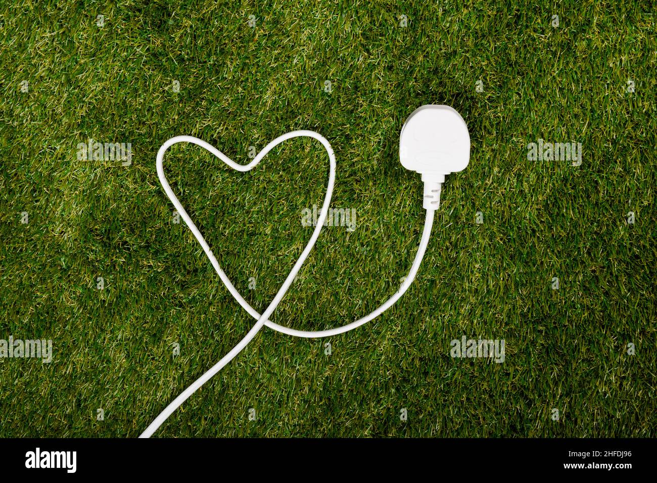 Energy saving concept of plug plugged into sustainable power source of ...