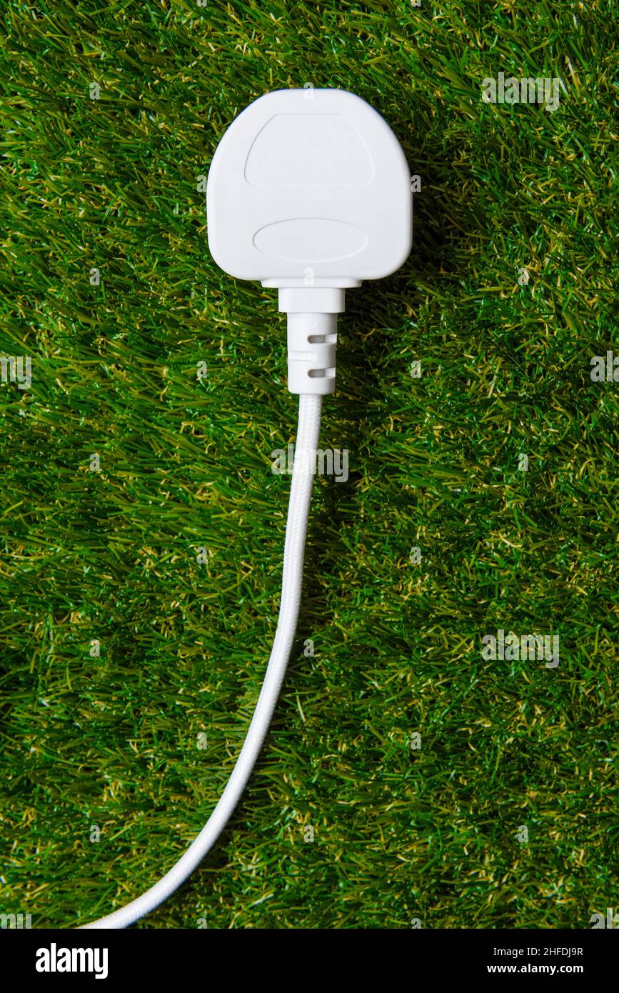 Energy saving concept of plug plugged into sustainable power source of ...