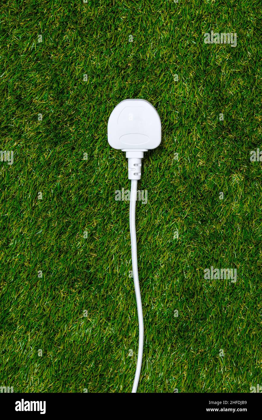 Energy saving concept of plug plugged into sustainable power source of ...