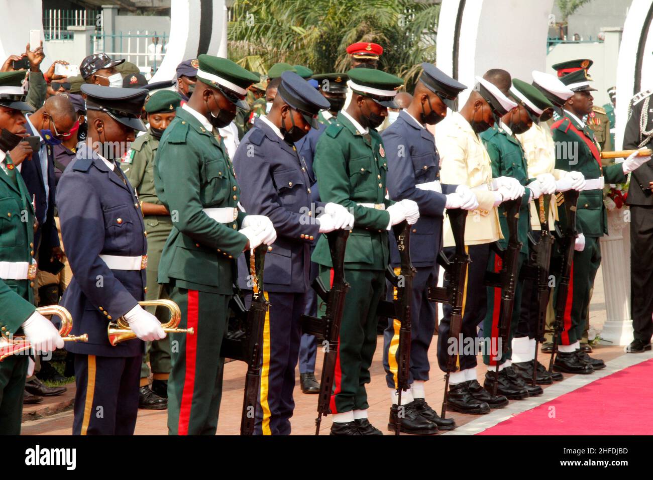 Lagos, Nigeria. 15th Jan, 2022. Military personnel bow during the parade and laying of wreath to ...