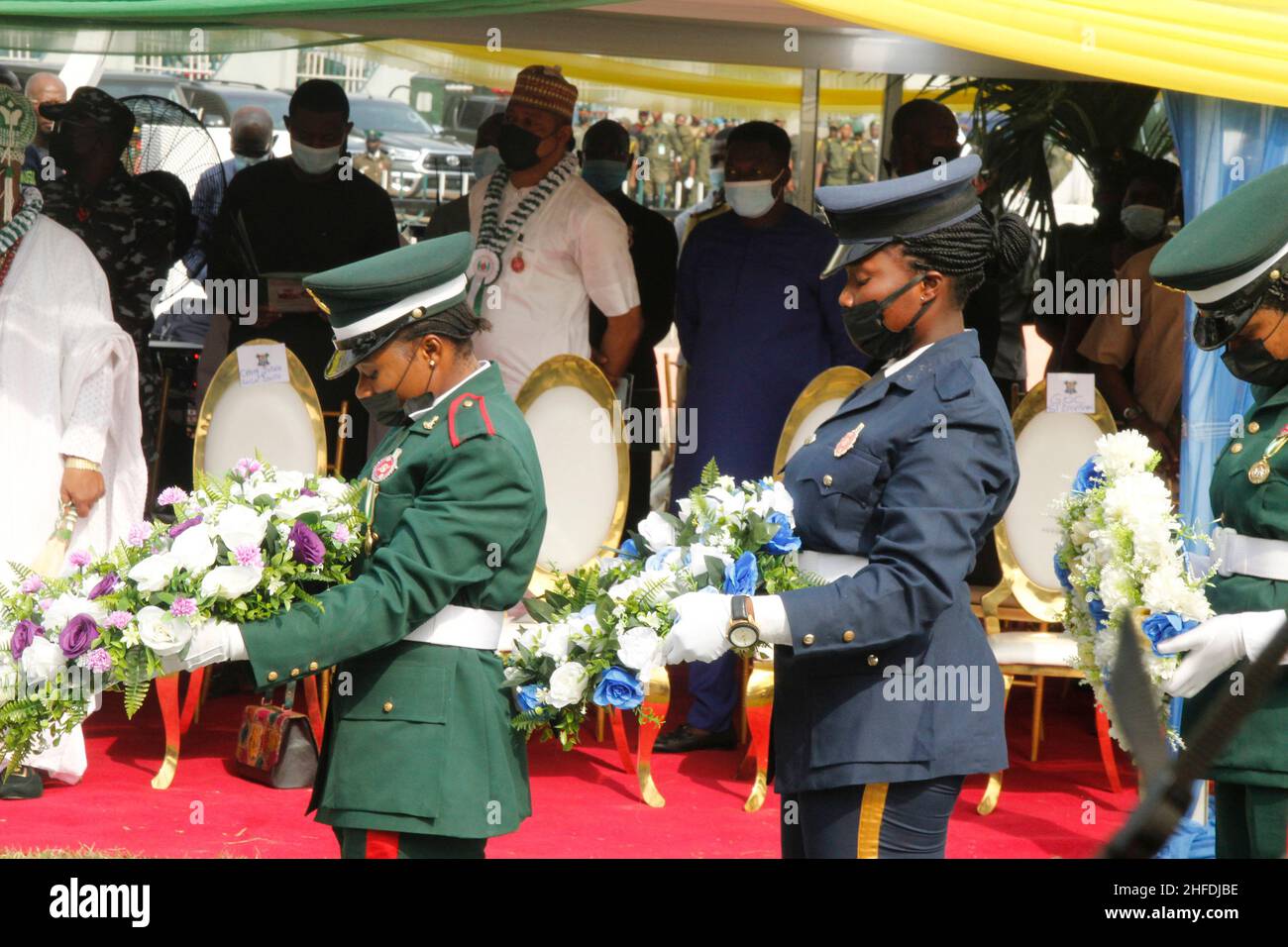 Lagos, Nigeria. 15th Jan, 2022. Military personnel carry wreathes during the parade and laying ...