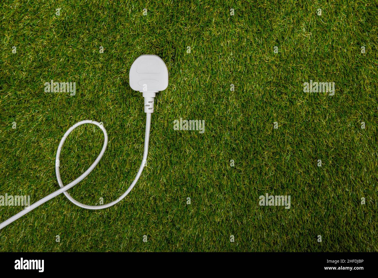 Energy saving concept of plug plugged into sustainable power source of ...