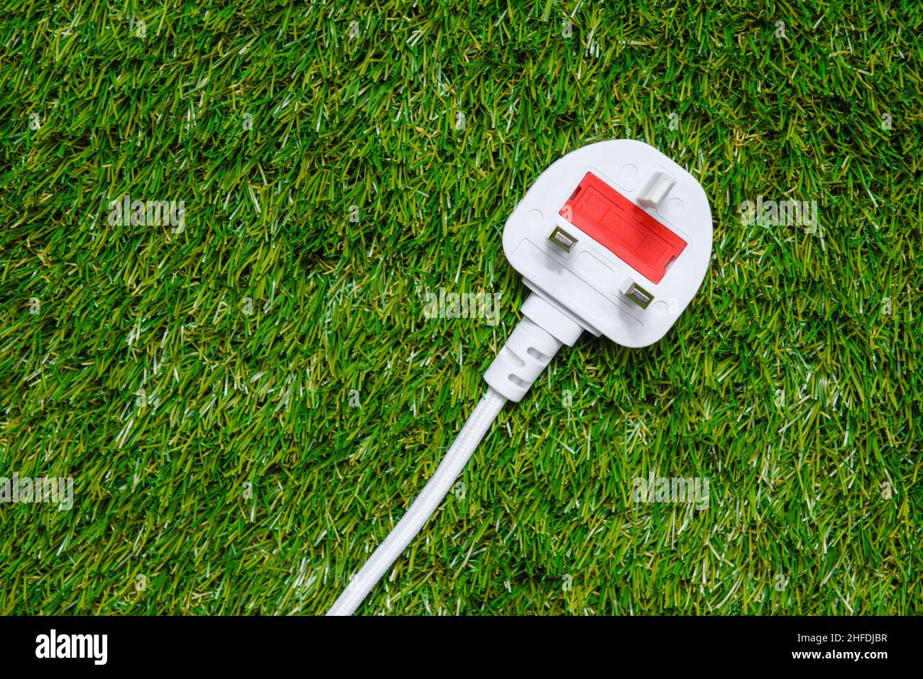 Energy saving concept of plug plugged into sustainable power source of ...
