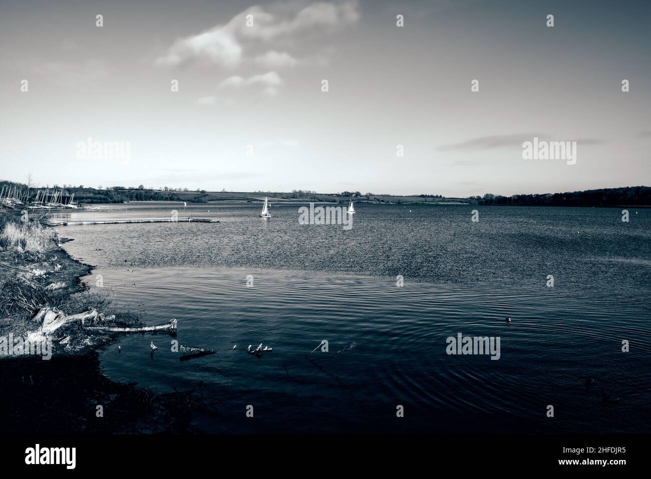 Wide angle water scenic landscape of unspoilt lake with reflections and ...