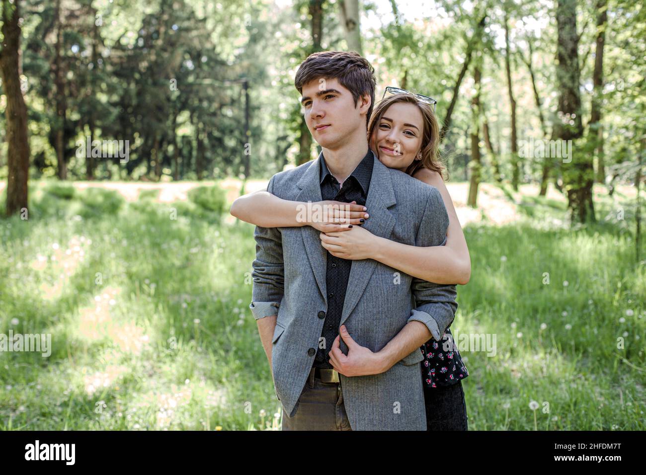 Happy couple on a walk in spring nature. The lifestyle of people of ...