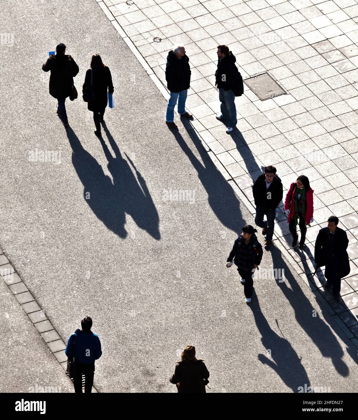 Long shadows people above street hi-res stock photography and images ...