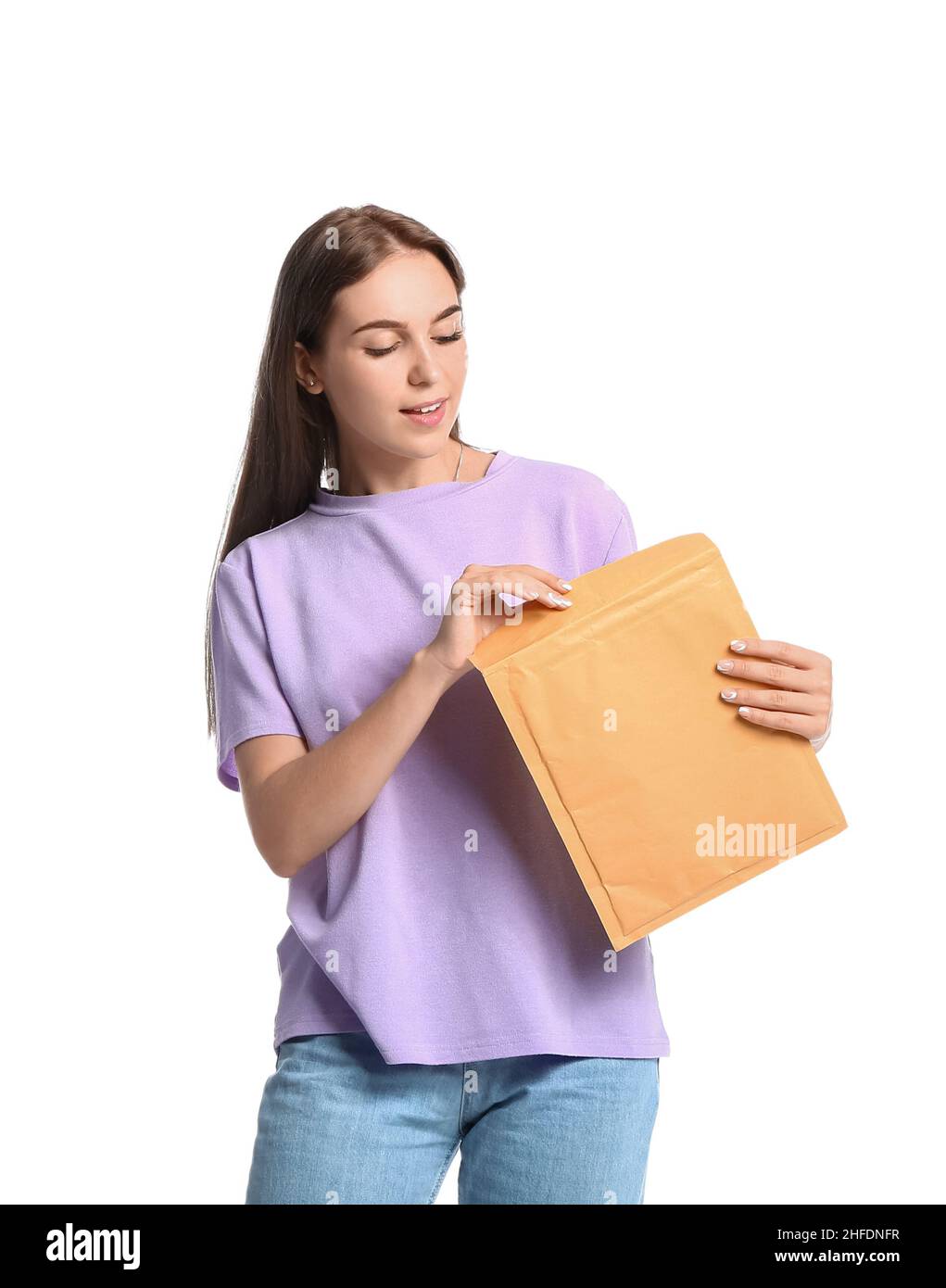 Pretty young woman with envelope on white background Stock Photo - Alamy