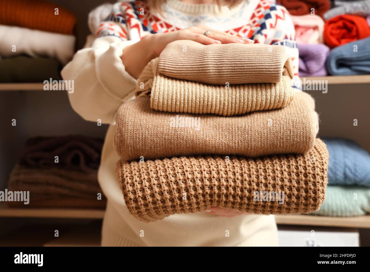 Woman sweaters closet hi-res stock photography and images - Alamy