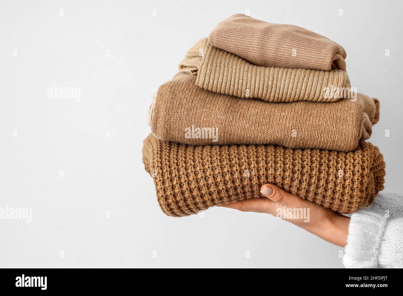 Woman sweaters closet hi-res stock photography and images - Alamy