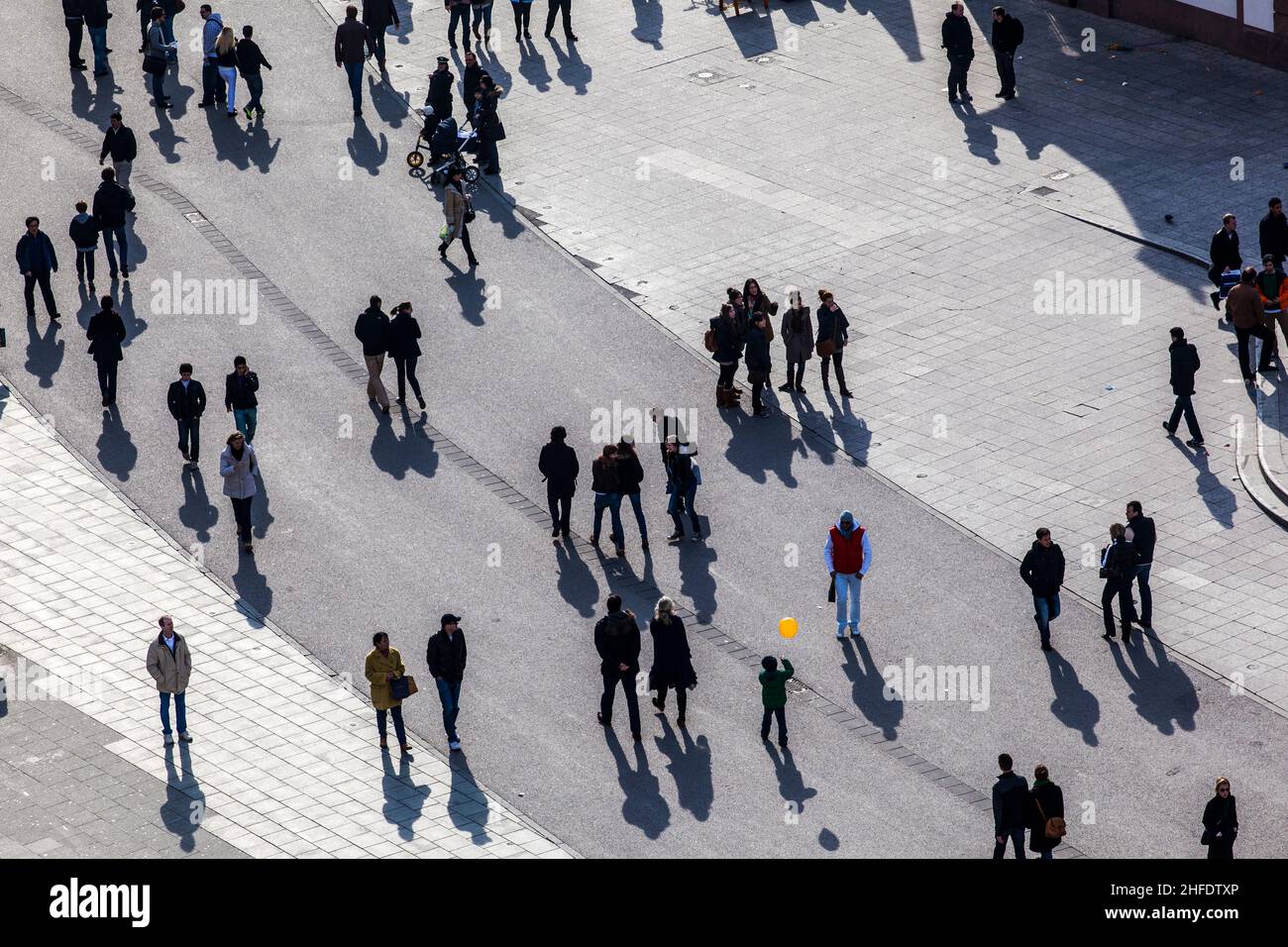 people walking at the street with long shadows Stock Photo - Alamy