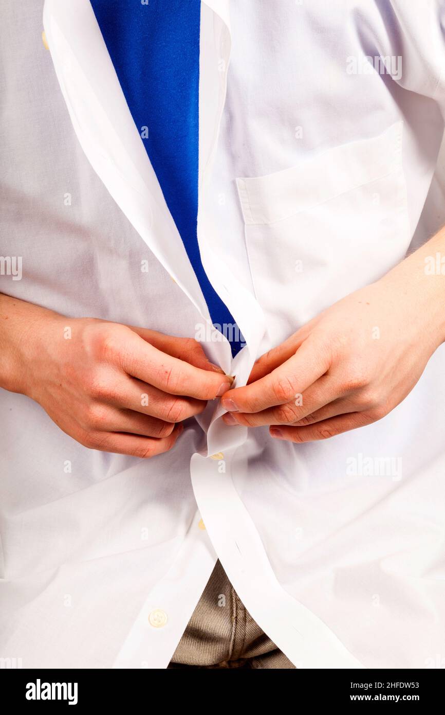 buttoning a fresh, white shirt, on plain white background Stock Photo ...