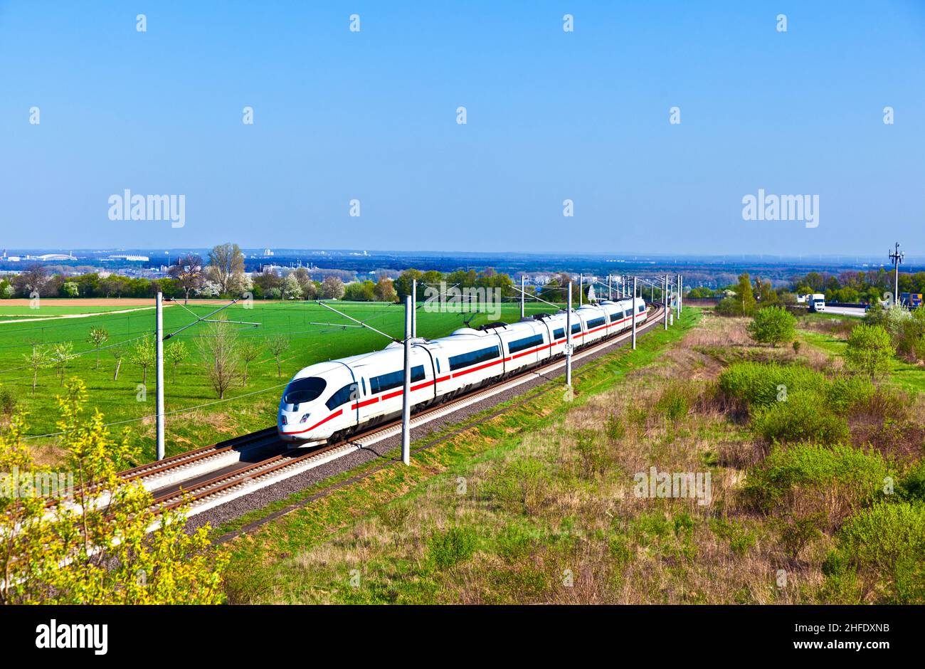 high speed train with full speed in landscape Stock Photo - Alamy
