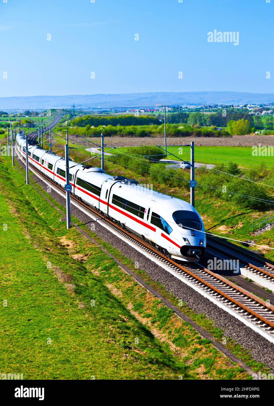 high speed train with full speed in landscape Stock Photo - Alamy