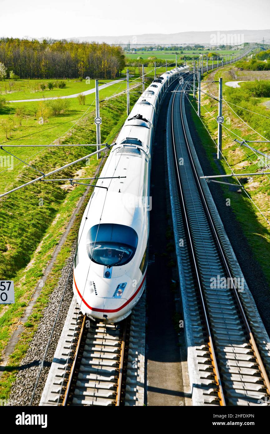 high speed train with full speed in landscape Stock Photo - Alamy