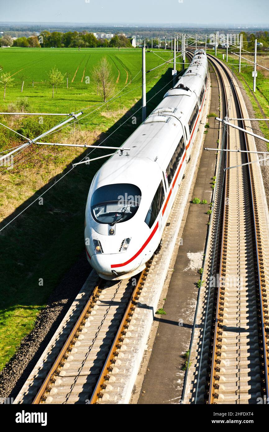 high speed train with full speed in landscape Stock Photo - Alamy