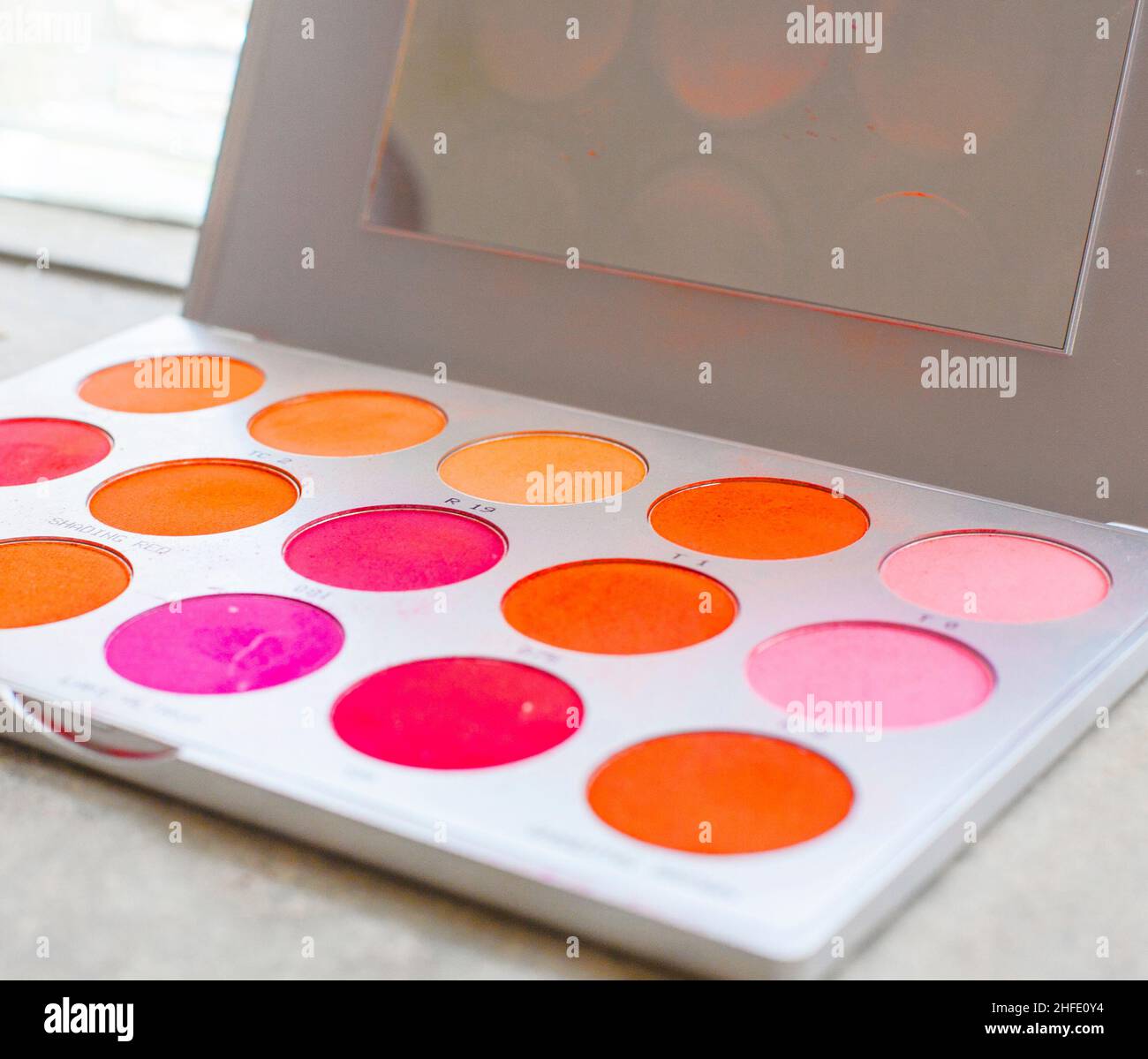 palette of makeup colors in red Stock Photo - Alamy