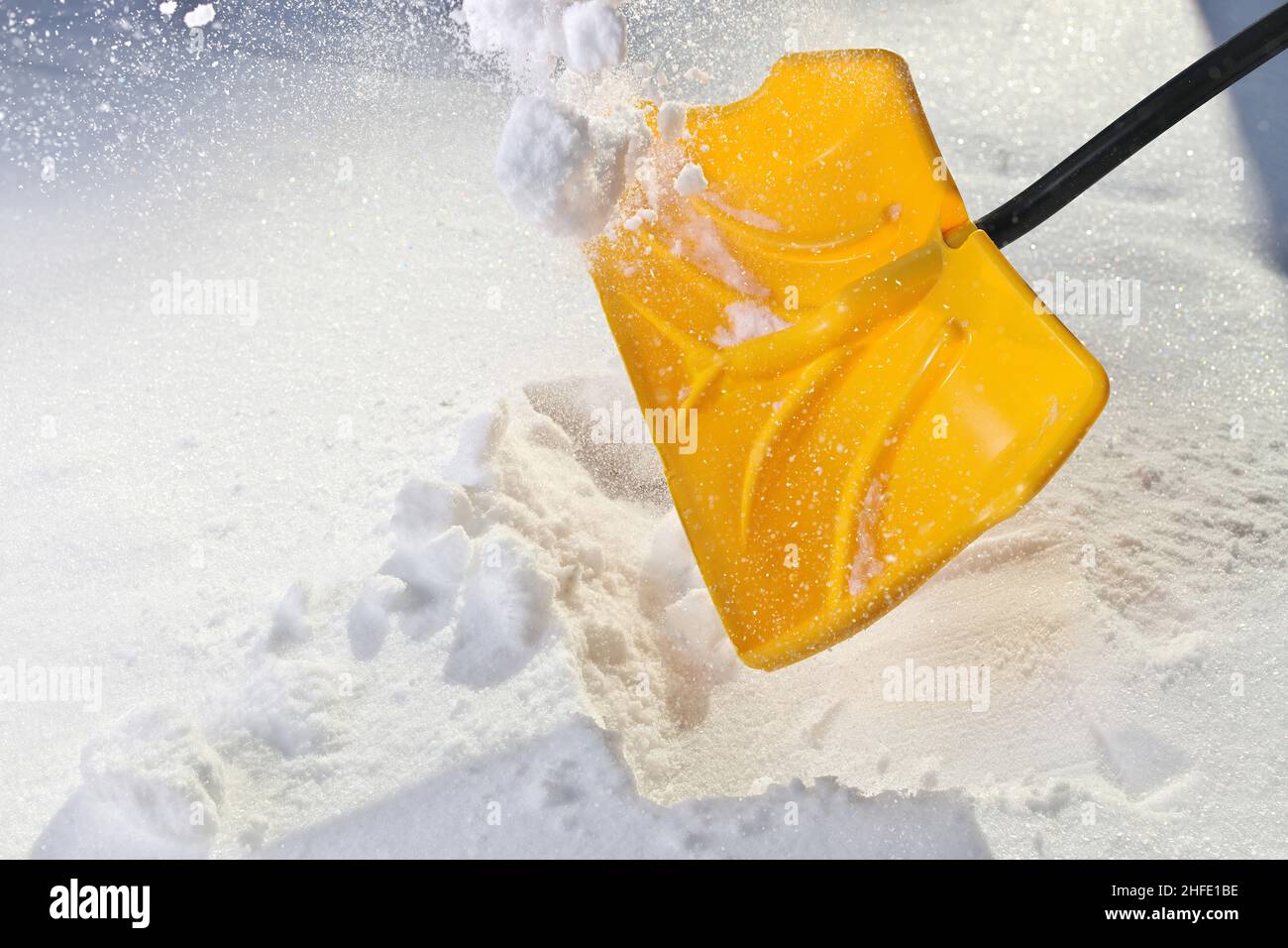 Yellow Snow Shovel Shoveling Fresh, Deep Powdery Snow Stock Photo - Alamy