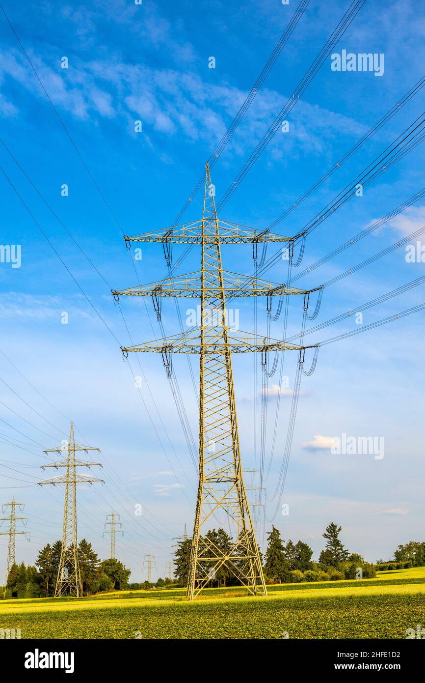 tower for electricity in rural landscape under blue sky Stock Photo - Alamy