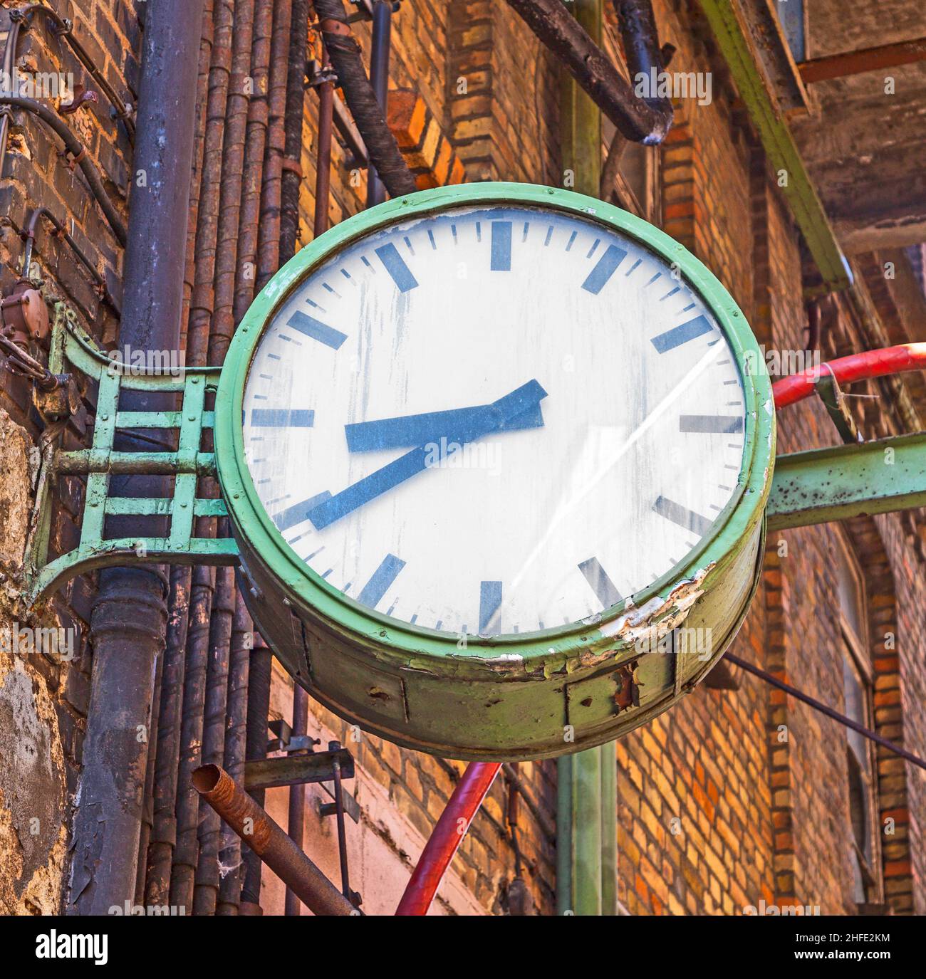clock in an old abandoned factory at the wall Stock Photo - Alamy