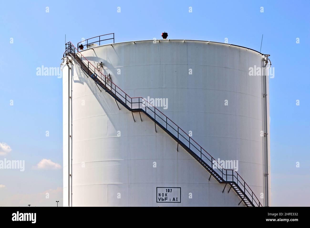 Big white industrial tank with blue sky Stock Photo - Alamy
