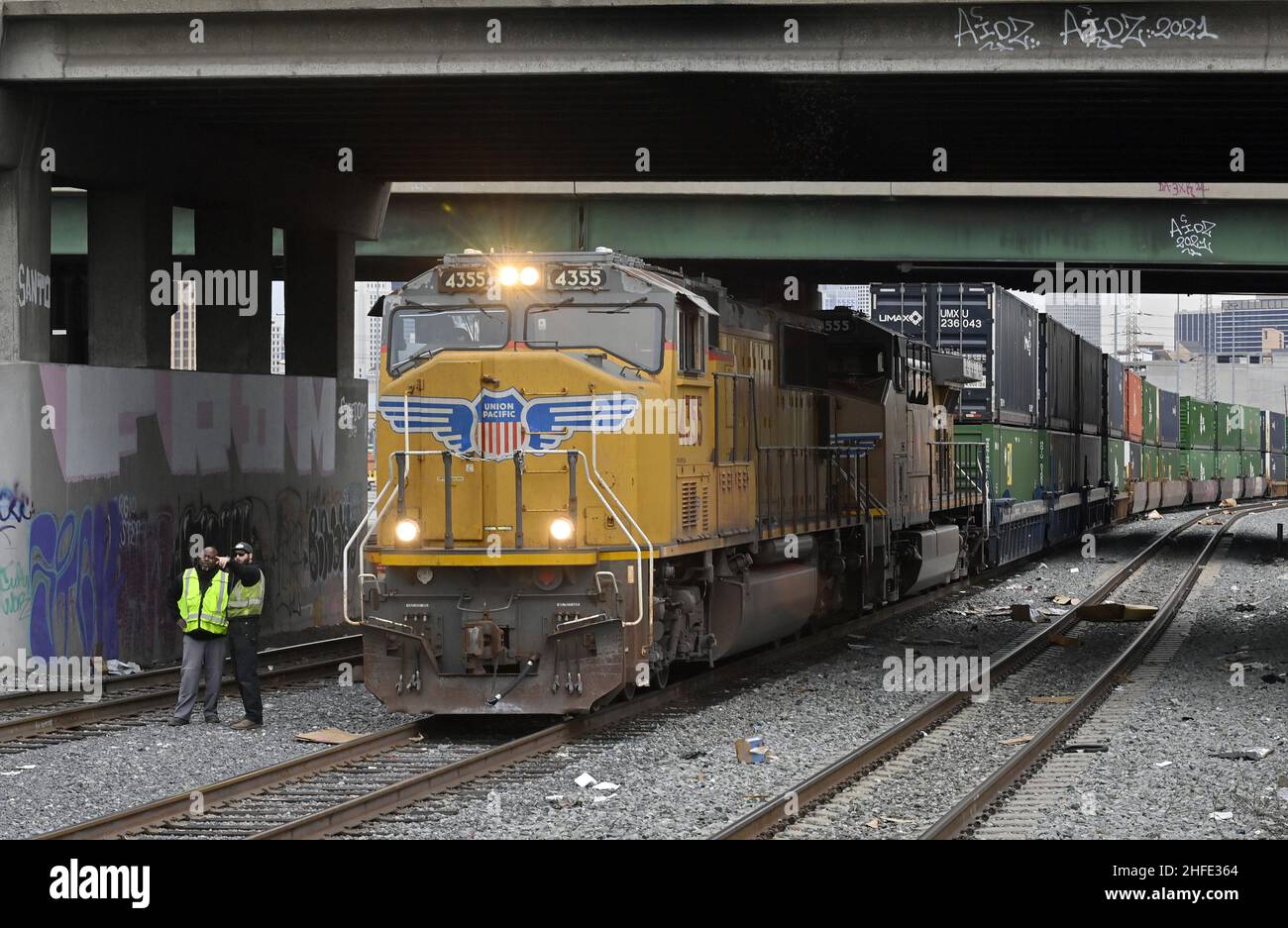 A Union Pacific freight train lies idle after another train deraiied ...