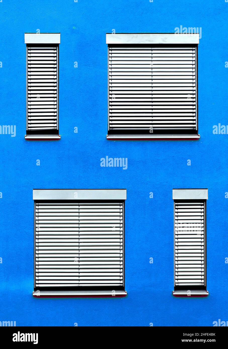 pattern of windows with red wall Stock Photo - Alamy