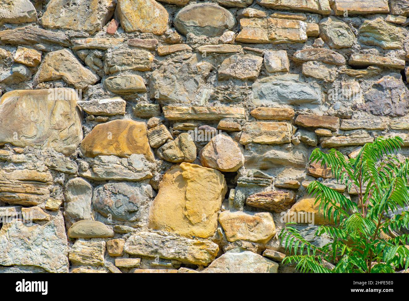 beautiful texture powerful wall of yellow stone Stock Photo - Alamy