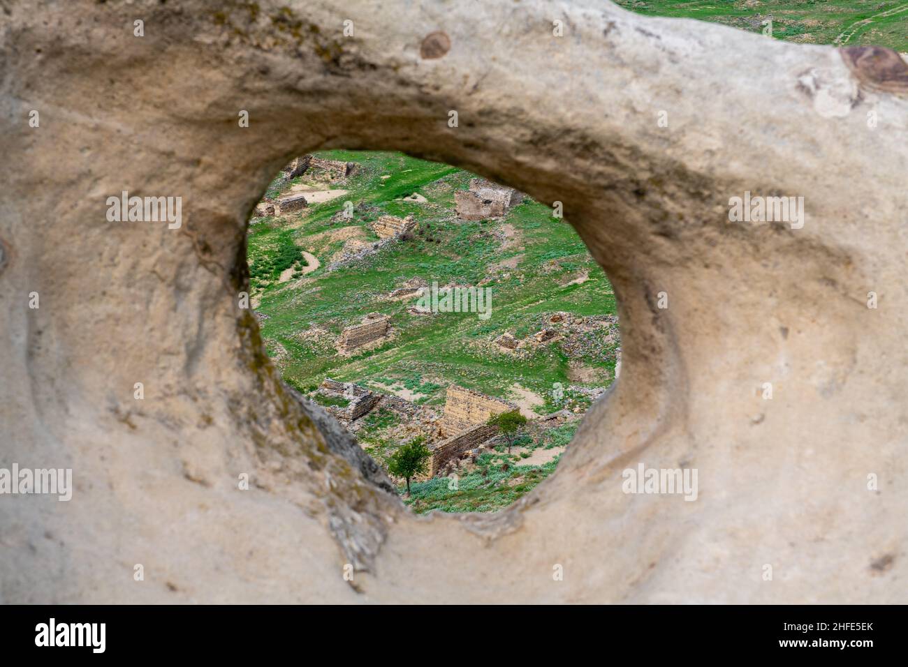 round hole in a cave in the city of uplistsikhe in Georgia Stock Photo ...