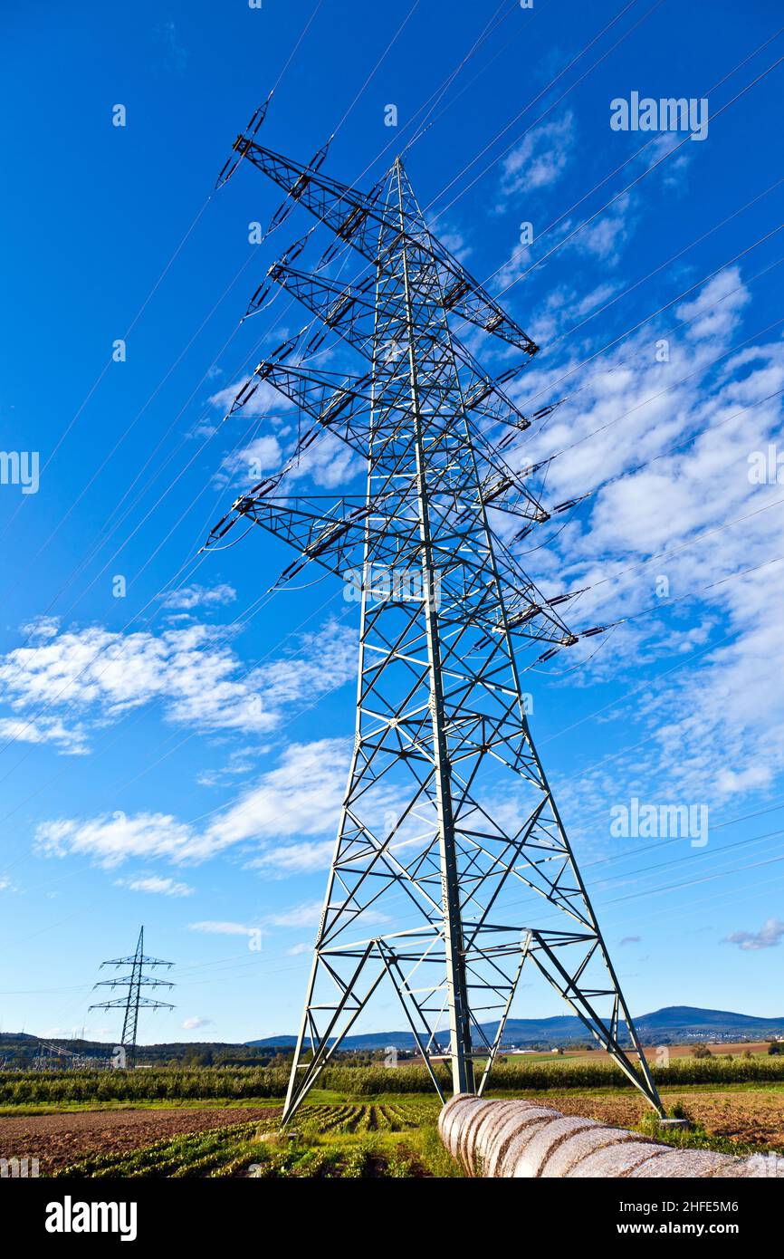 Steel electricity pylon on bright blue sky Stock Photo - Alamy