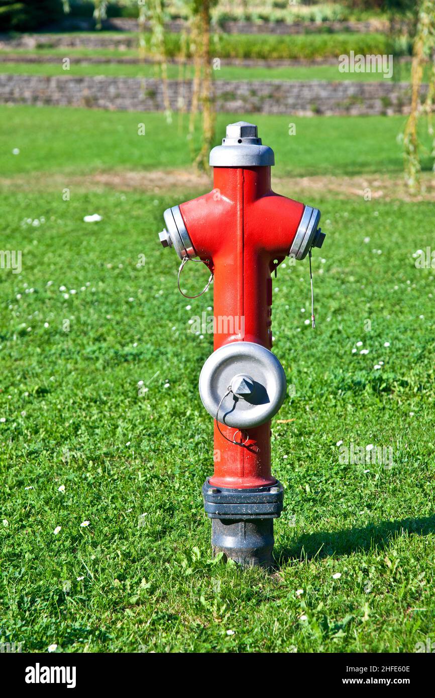 red hydrant at the meadow Stock Photo - Alamy