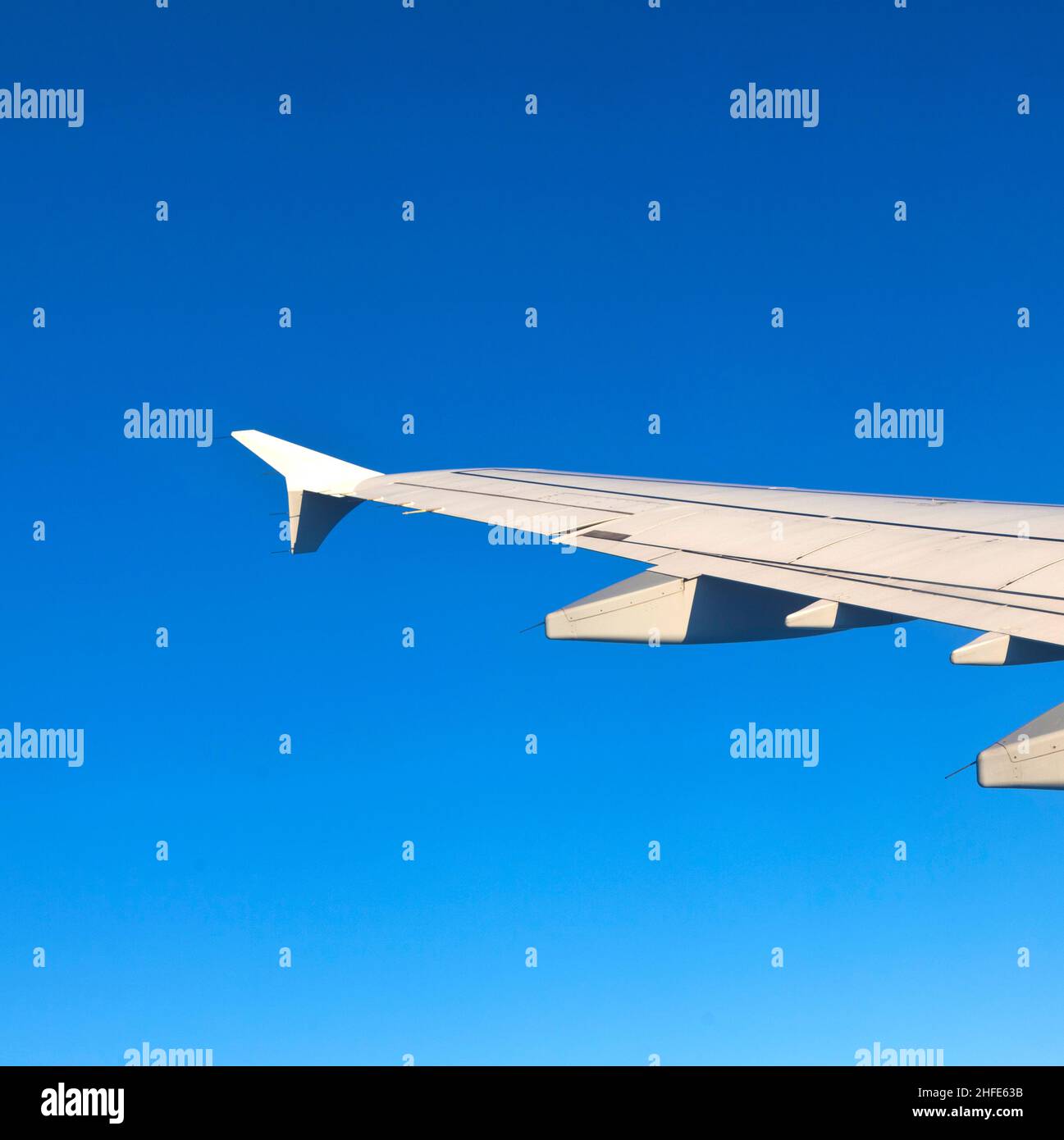 detail of aircraft wing under blue sky Stock Photo - Alamy