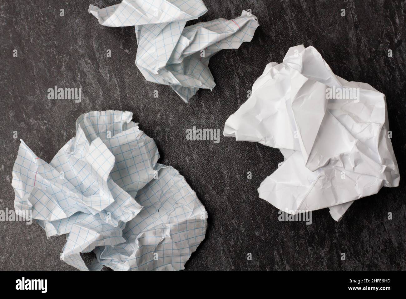 Crumpled and torn paper on the table. Torn piece of notebook. Paper ...