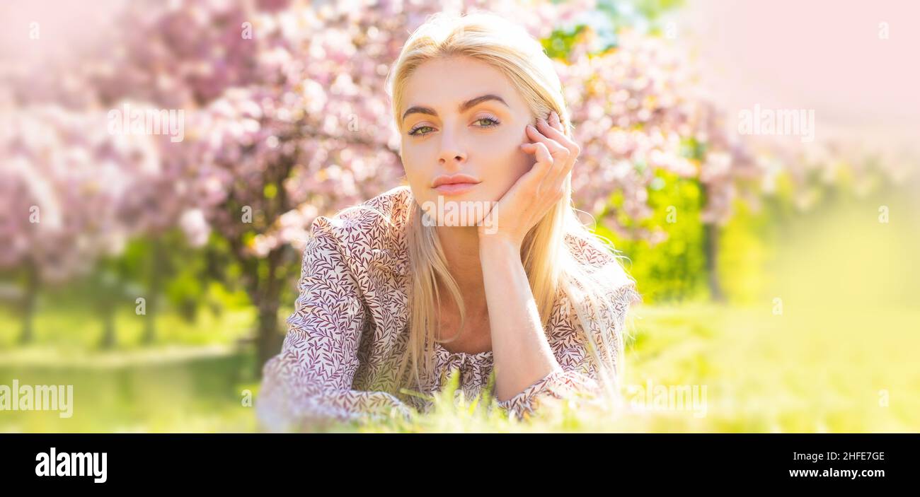 Spring woman face for banner. Beautiful girl in pink flowers in summer ...