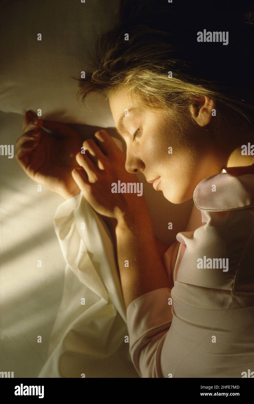 Pretty blond hair beauty sleeping face sleeping in bed portrait profile ...