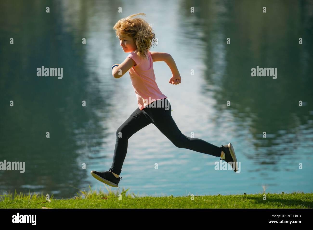 Kids jogging in park outdoor. Little boy running in nature. Run ...