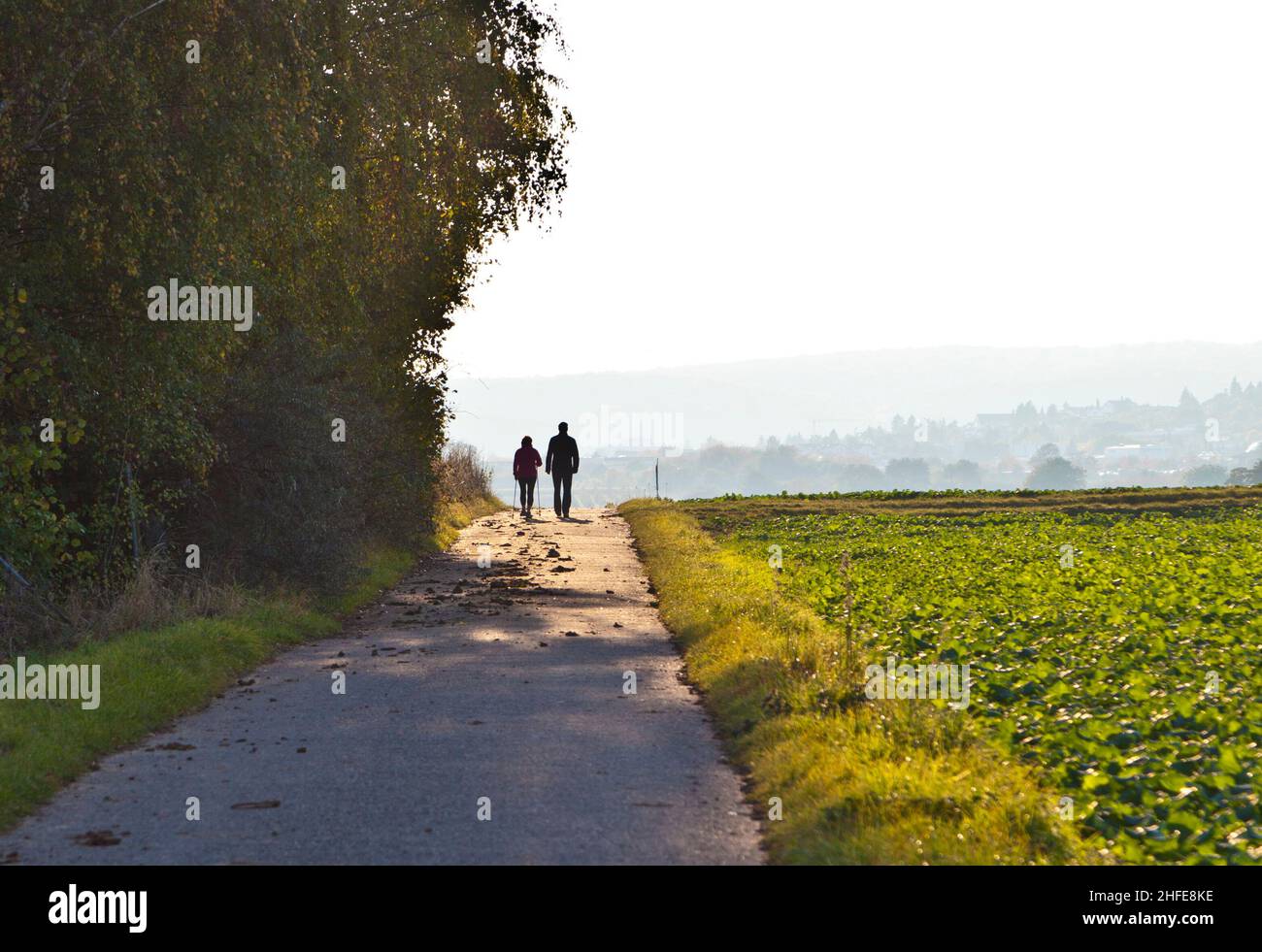 couple walking on a pathway Stock Photo - Alamy