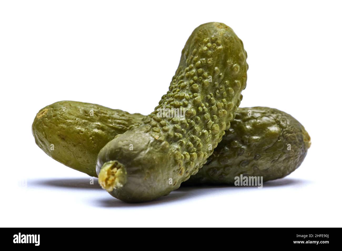 Tasty Whole green cornichons isolated on a white background Stock Photo ...
