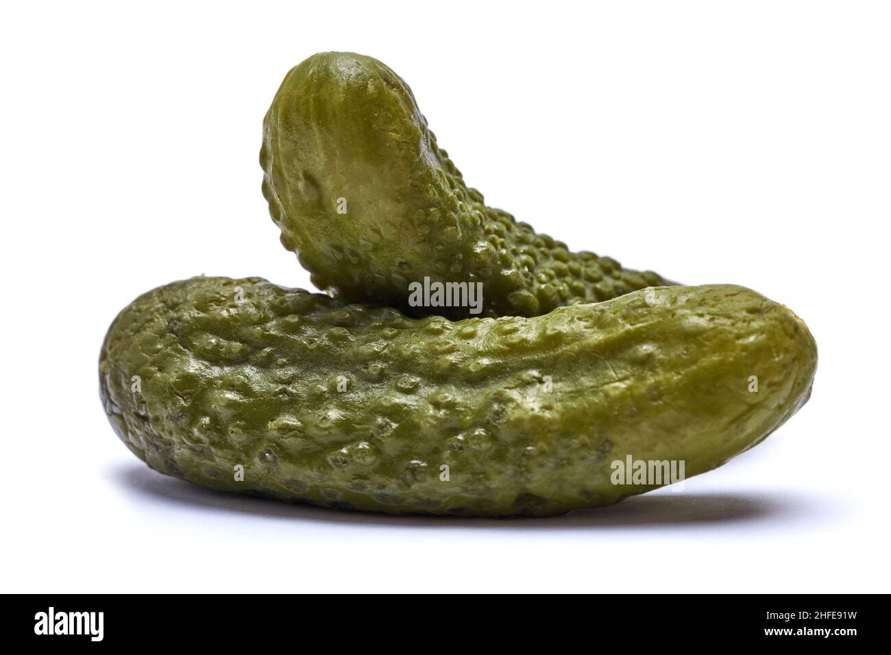 Tasty Whole green cornichons isolated on a white background Stock Photo ...