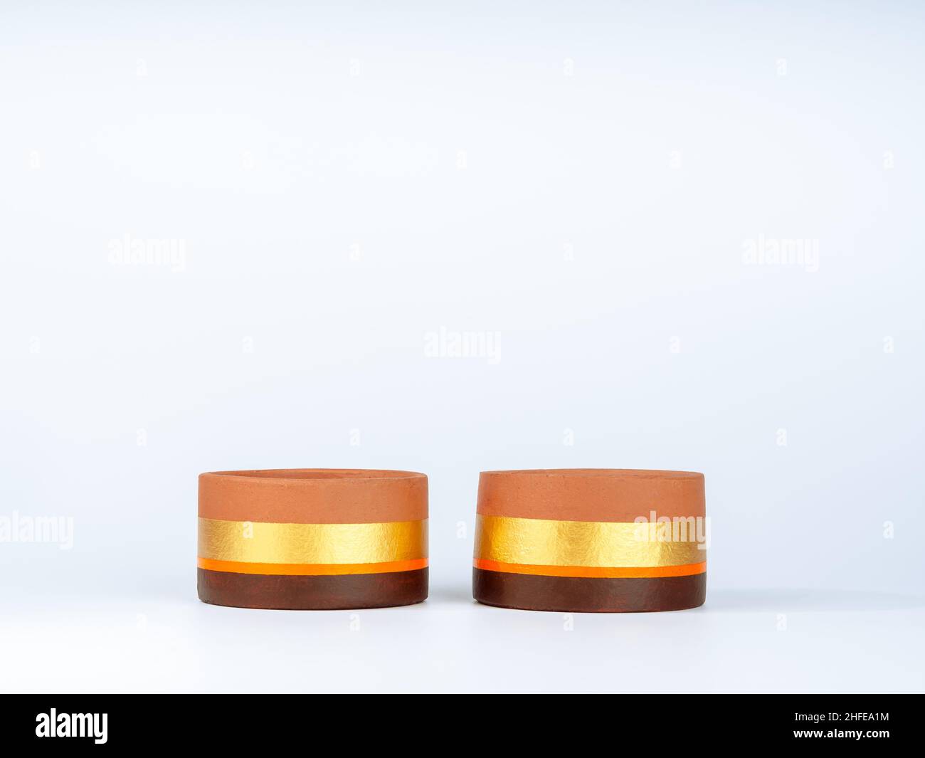 Two empty terra cotta pots isolated on white background with copy space ...