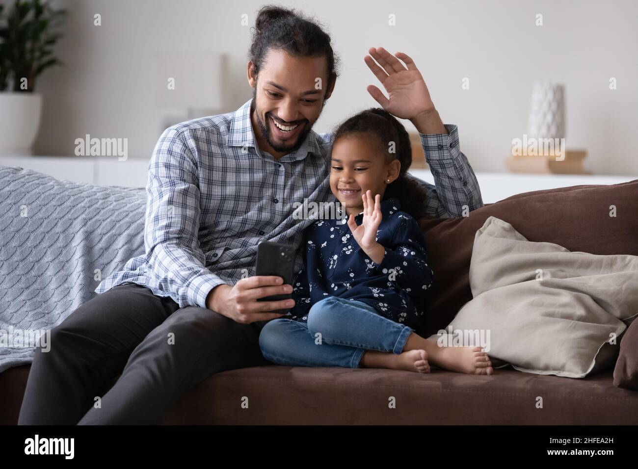 Happy dad and cheerful cute kid talking on video call Stock Photo - Alamy